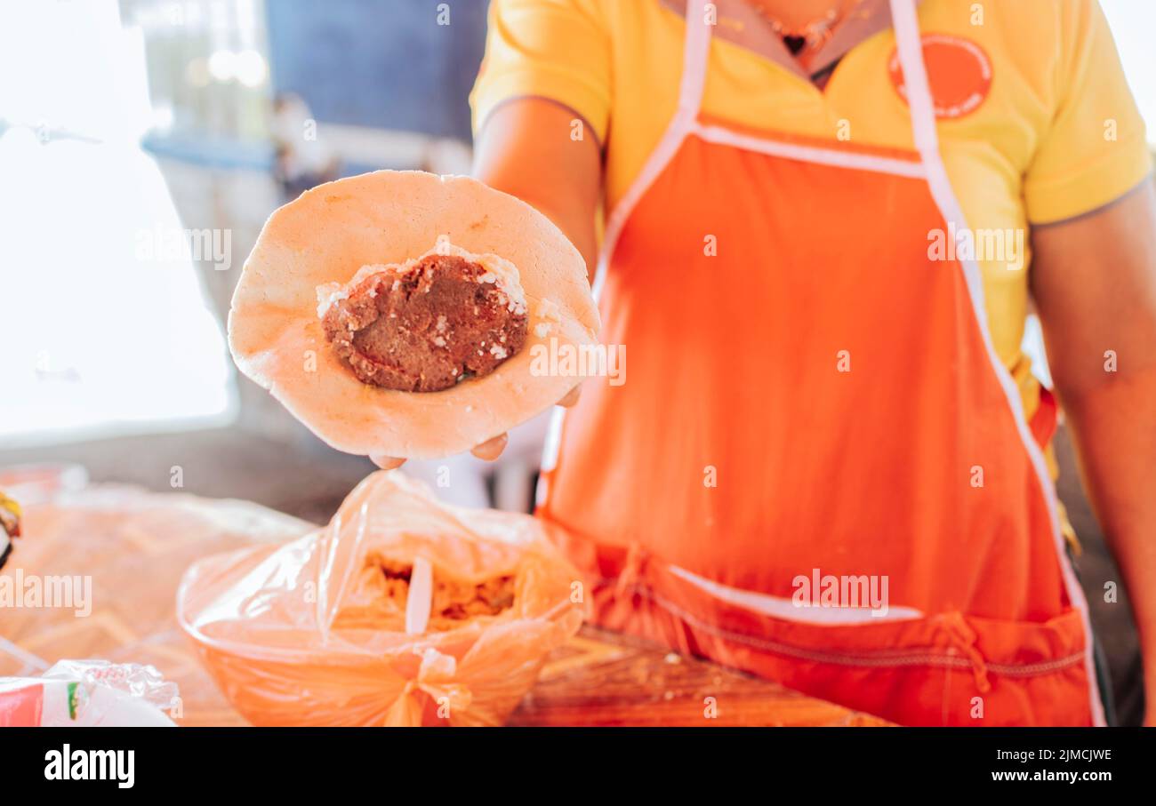 Hand Of A Vendor Showing Traditional Raw Pupusa Elaboration Of Traditional Pupusas Preparation