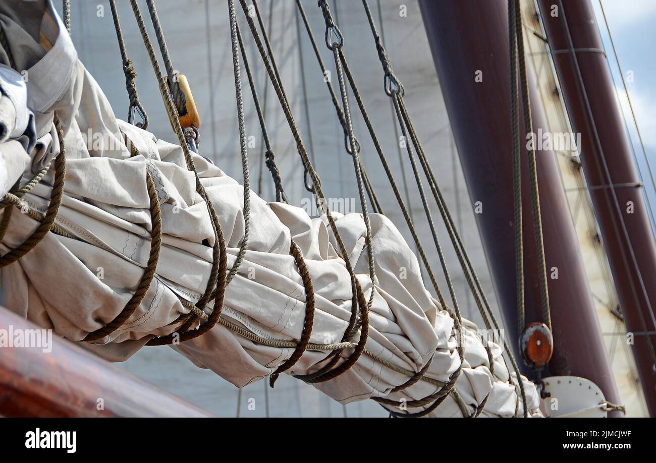 White sail tied together, sailing ship, Baltic Sea Stock Photo - Alamy