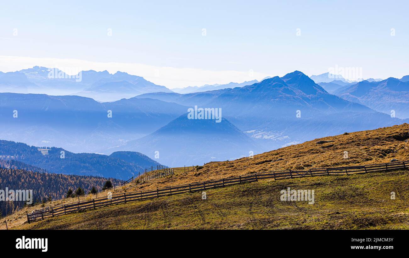 Alpine meadows with wooden fence, the mountain backdrop of the ...