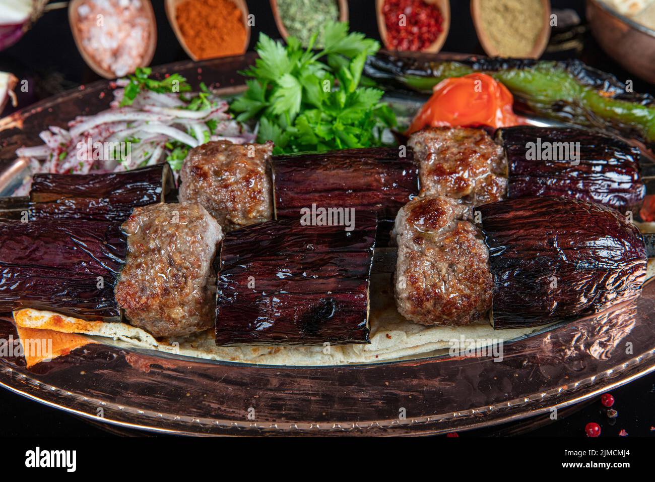 Traditional Turkish kebabs. Eggplant kebab, Adana kebab. With tomatoes ...