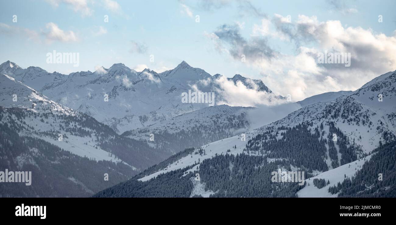 View of the Grossglockner, Alps in winter with snow-covered mountains ...
