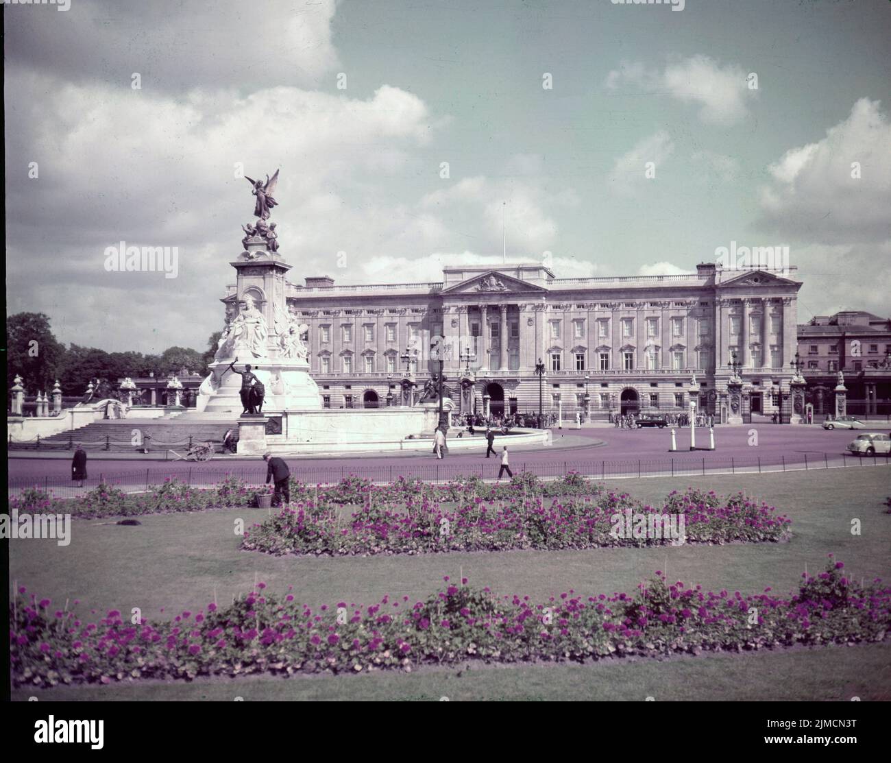 Circa 1965, London, England, United Kingdom: Garden lawn and flowers in ...