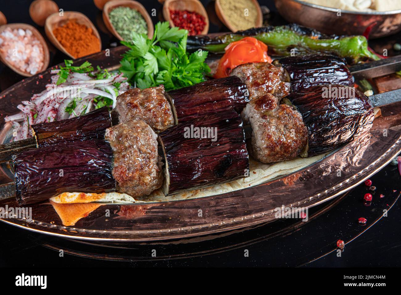 Traditional Turkish kebabs. Eggplant kebab, Adana kebab. With tomatoes ...