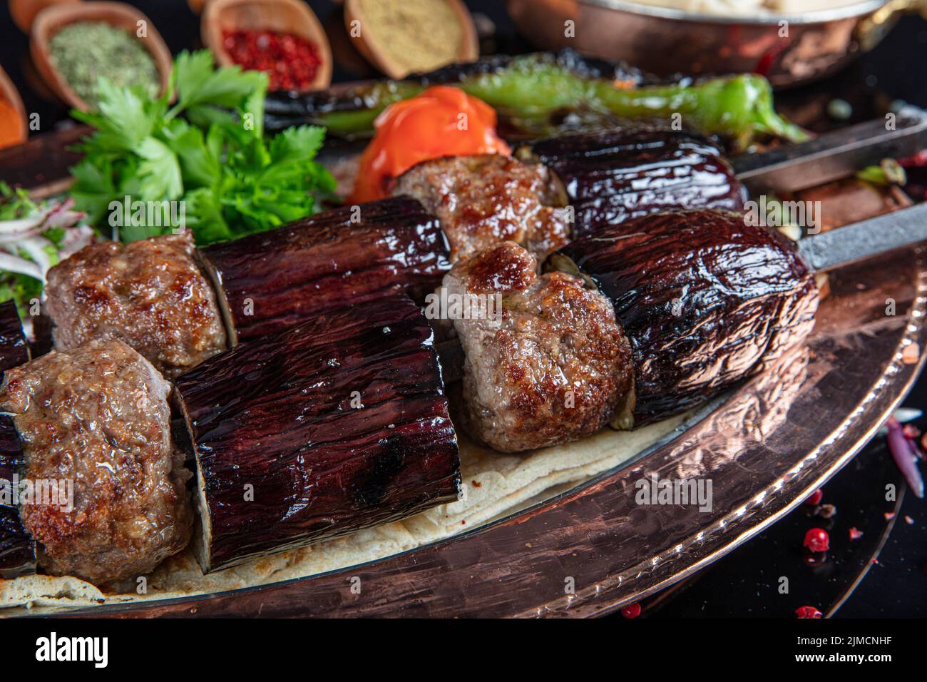 Traditional Turkish kebabs. Eggplant kebab, Adana kebab. With tomatoes ...