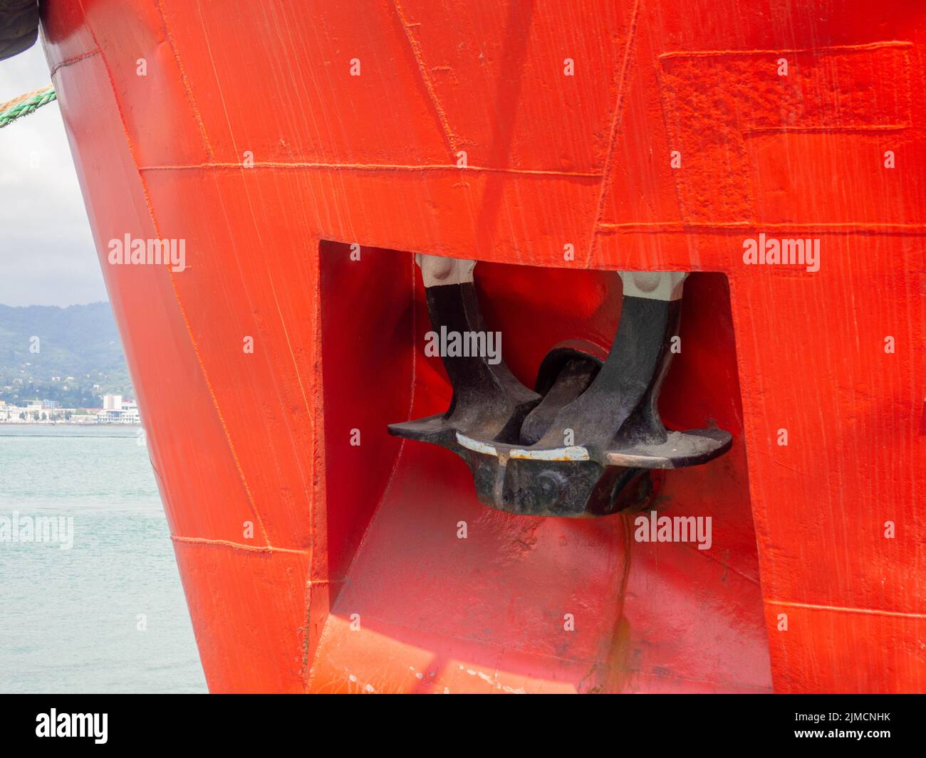 Anchor on a ship. Ship at the pier. Iron large anchor not lowered. Sea ...