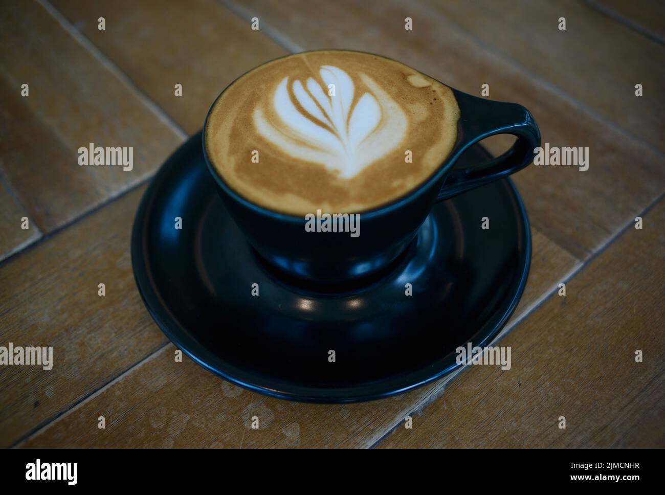 A warm cup of coffee in a beautiful coffee shop Stock Photo - Alamy