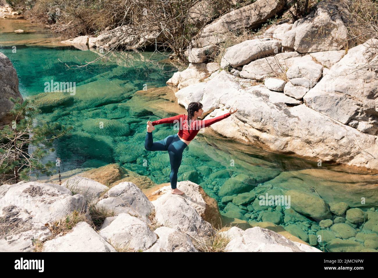 Woman practicing the dancer pose in the river Stock Photo - Alamy