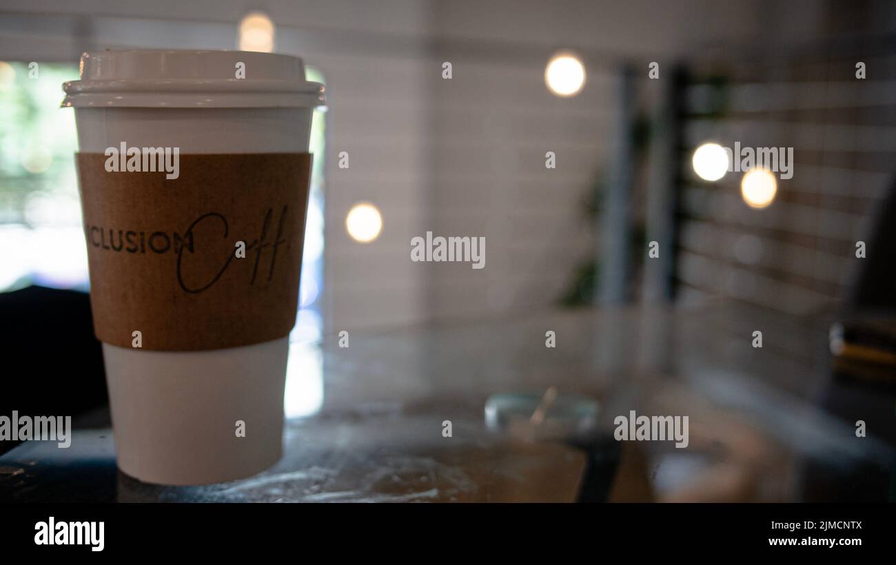 Coffee cup and glass of water on desk with hi-res stock photography and ...