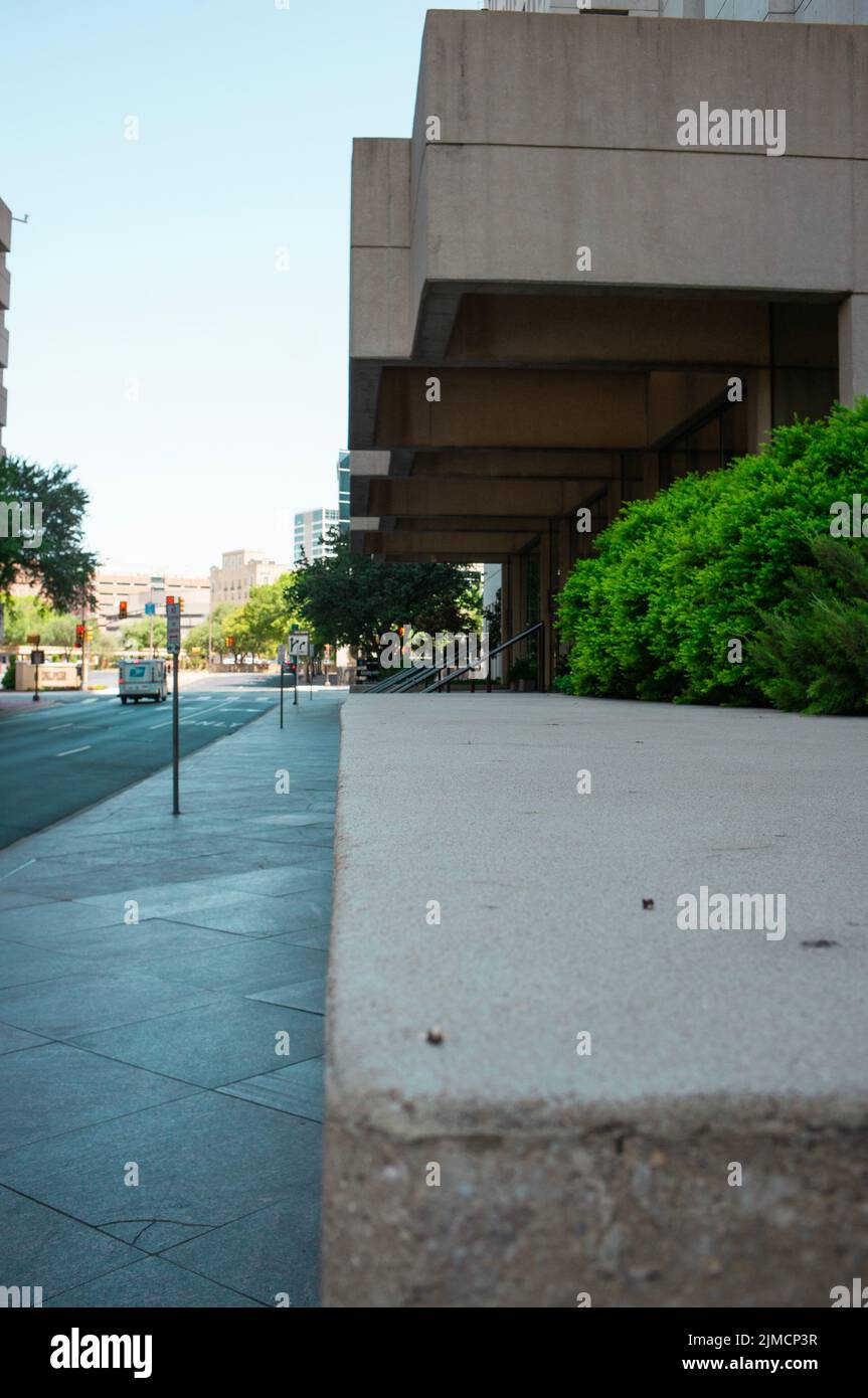 A long street with pretty bushes to the side Stock Photo - Alamy