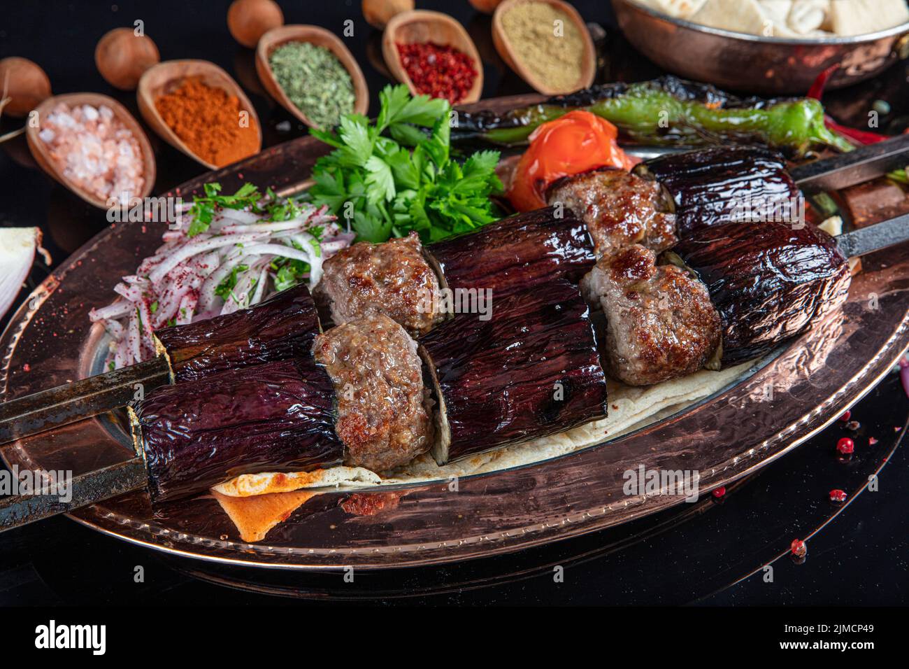Traditional Turkish kebabs. Eggplant kebab, Adana kebab. With tomatoes ...