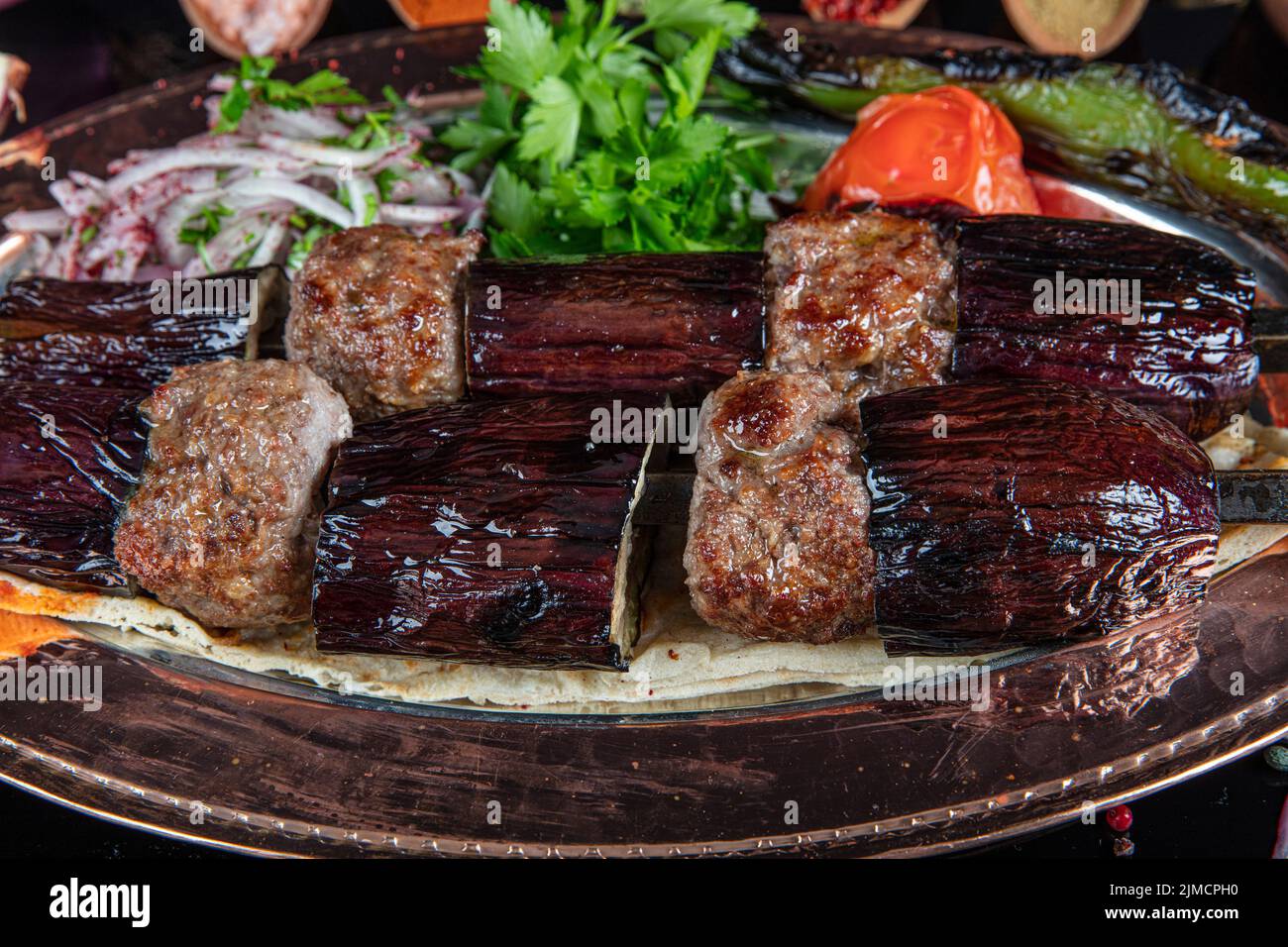 Traditional Turkish kebabs. Eggplant kebab, Adana kebab. With tomatoes ...