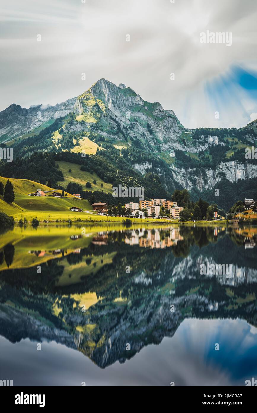 Spectacular scenery of small residential cottages located on grassy ...