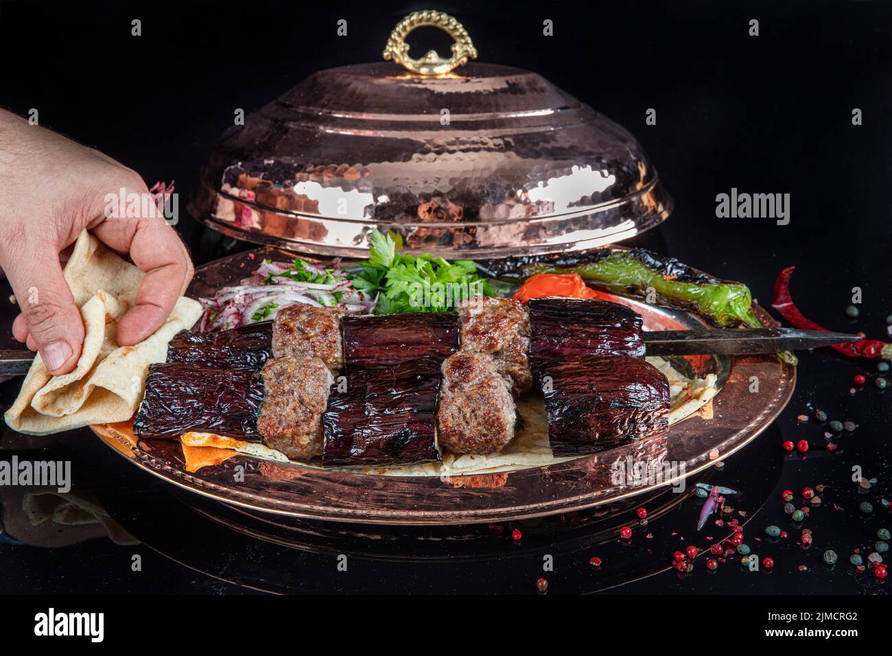 Traditional Turkish kebabs. Eggplant kebab, Adana kebab. With tomatoes ...