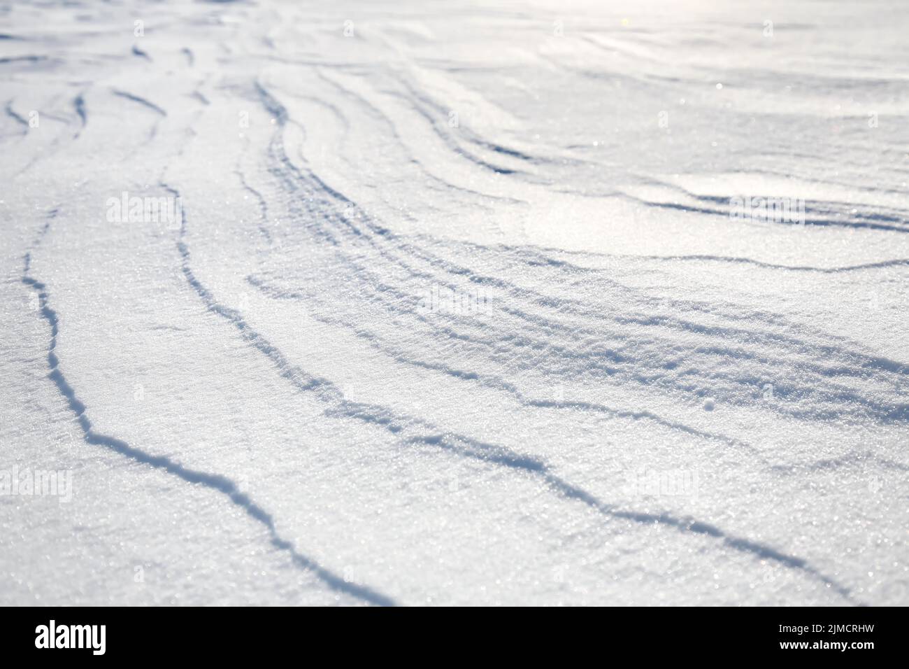 Snow drifts caused by wind from powder snow look like dunes and form ...