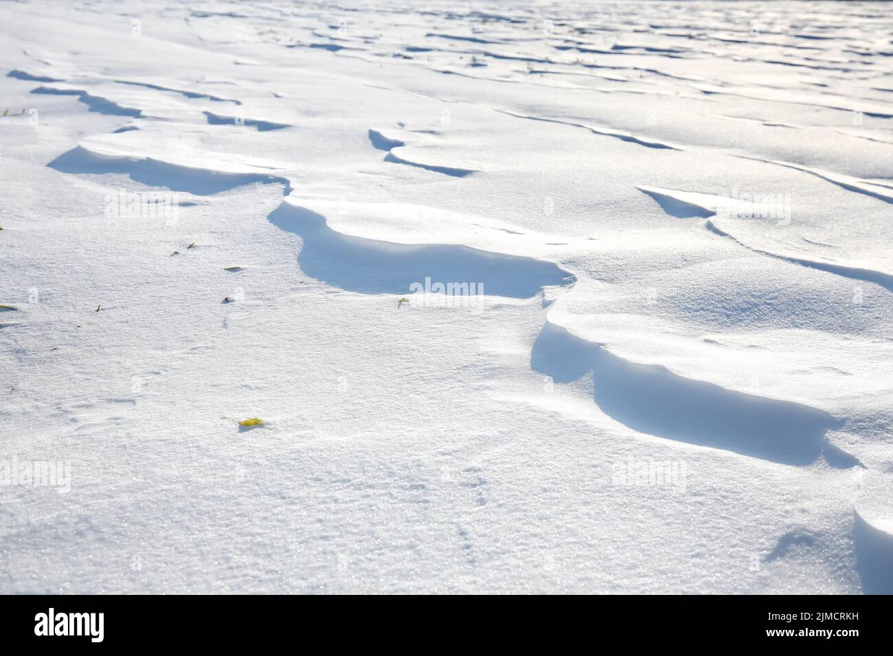 Snow drifts caused by wind from powder snow look like dunes and form ...