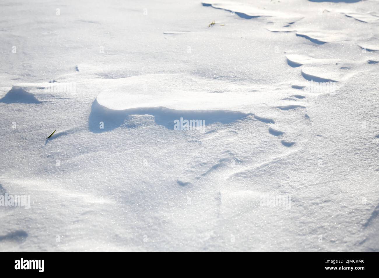 Snow drifts caused by wind from powder snow look like dunes and form ...