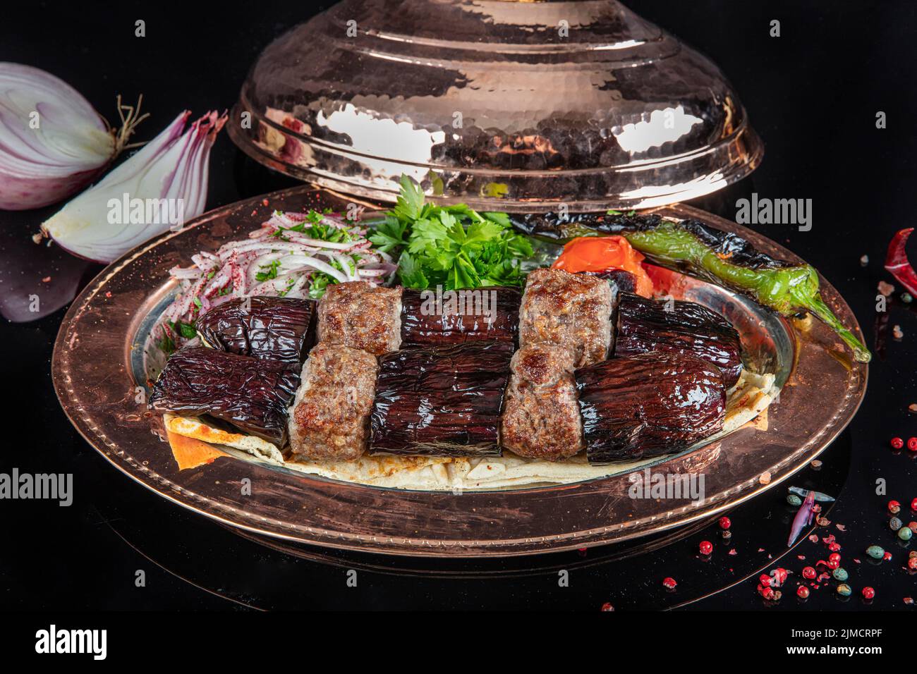 Traditional Turkish kebabs. Eggplant kebab, Adana kebab. With tomatoes ...