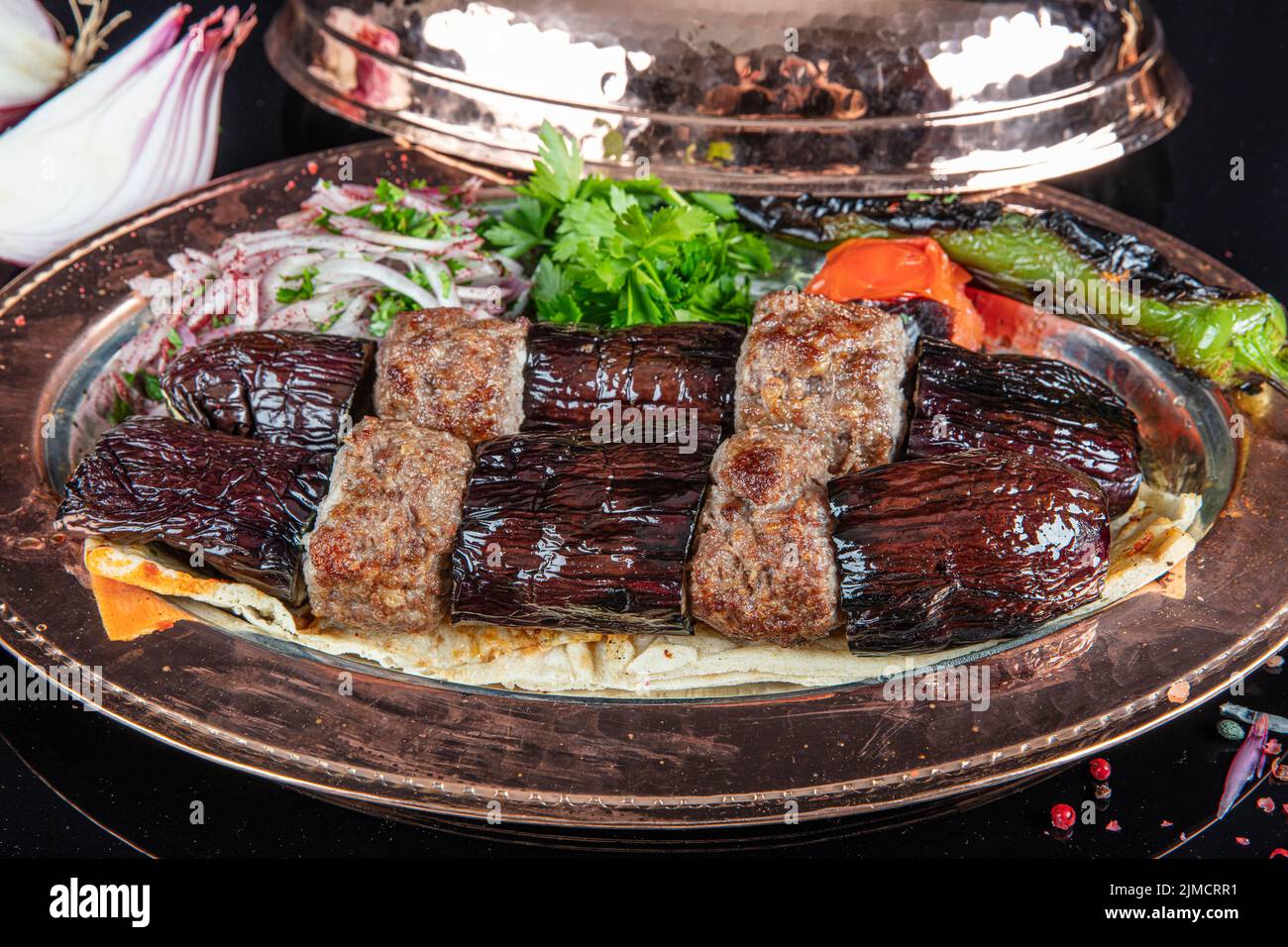 Traditional Turkish kebabs. Eggplant kebab, Adana kebab. With tomatoes ...