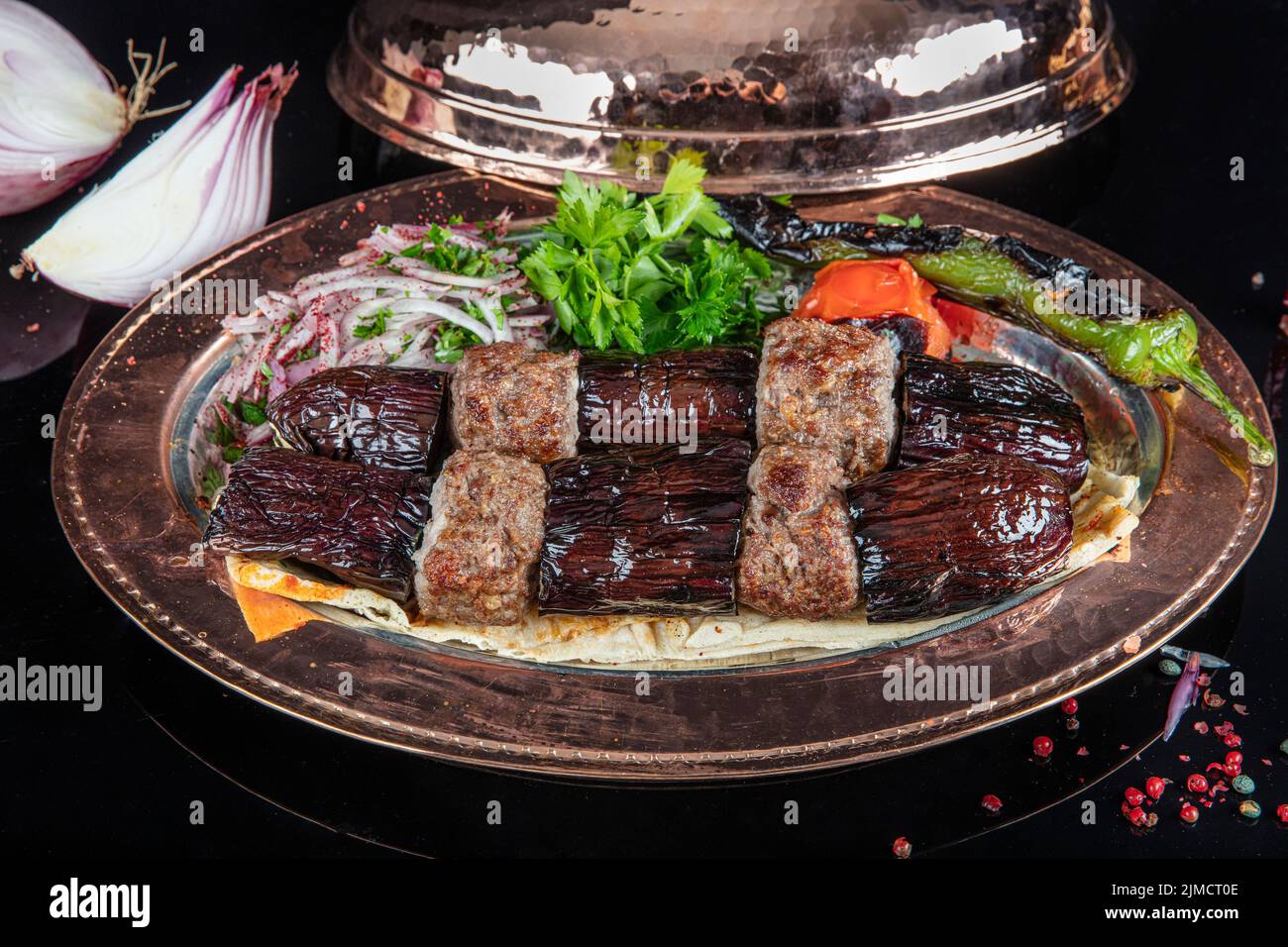 Traditional Turkish kebabs. Eggplant kebab, Adana kebab. With tomatoes ...