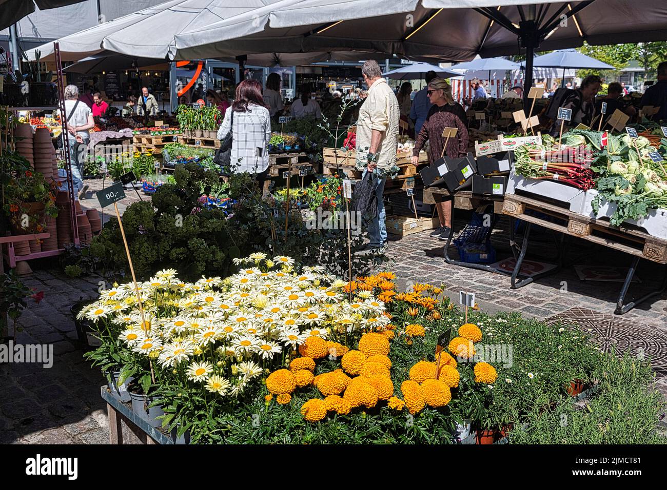 Visitors in front of the Torvehallerne market hall, market stalls with ...