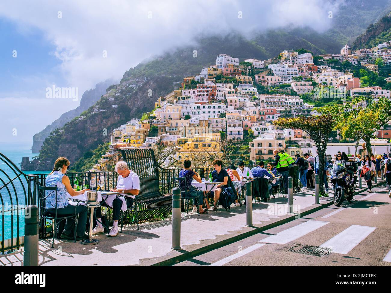 Street restaurant with panorama of the village, Positano, Amalfi Coast ...