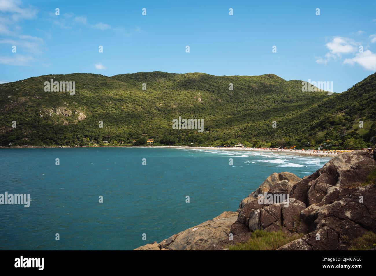 Beach and blue ocean water Stock Photo - Alamy