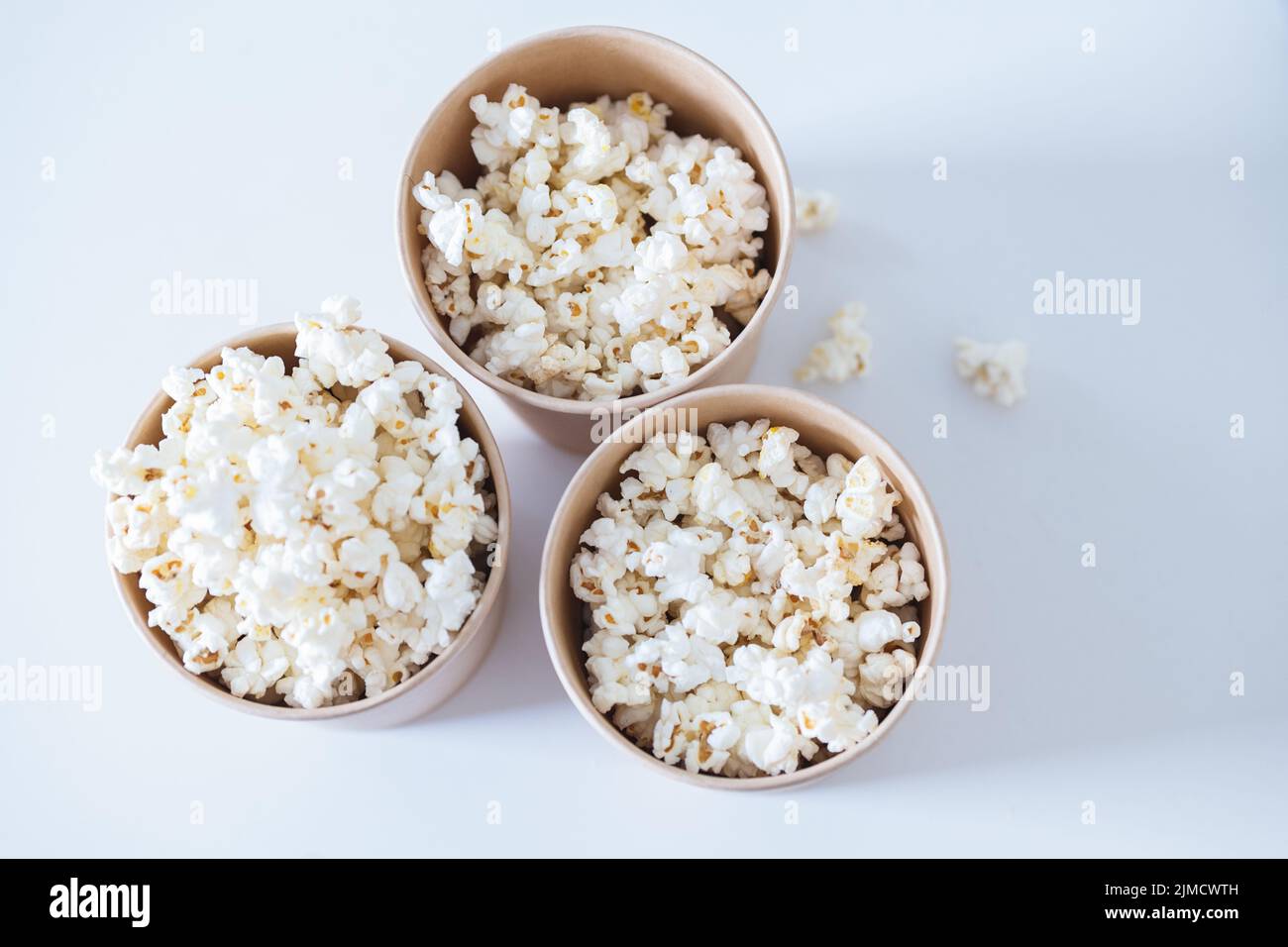 Top view of carton buckets filled with tasty popcorn prepared for ...