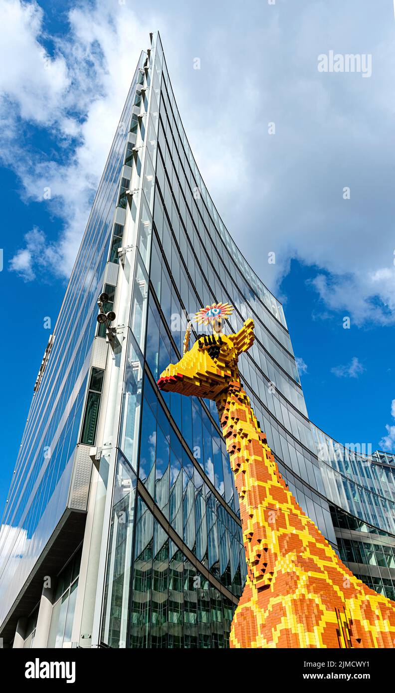 Giraffe made of Lego bricks in front of the entrance to Legoland at the ...