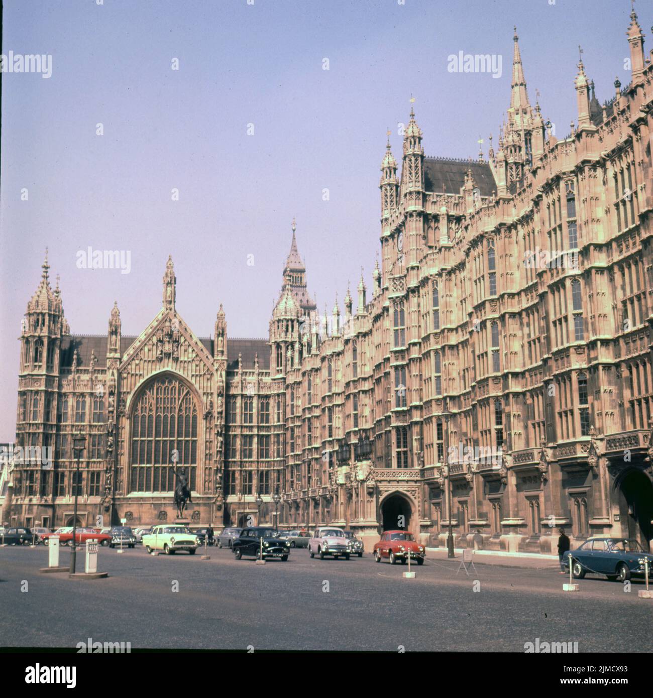 Circa 1965, London, England, United Kingdom: Cars drive past Houses of ...