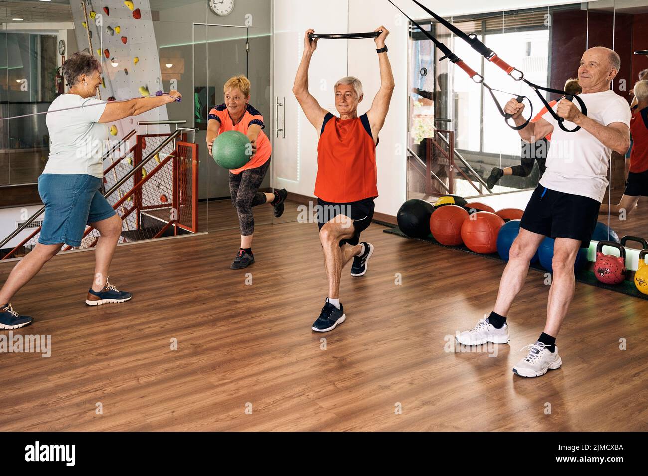 Group of positive determined senior male and female athletes in ...