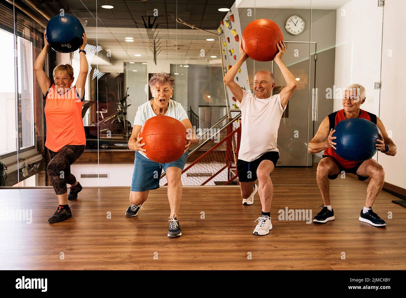 Full body of cheerful active elderly male and female athletes in ...