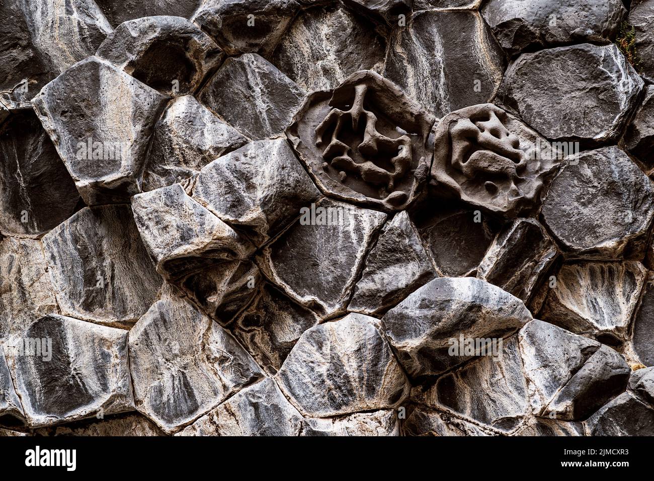 From below of textured surface of columnar basalt rock formation as ...