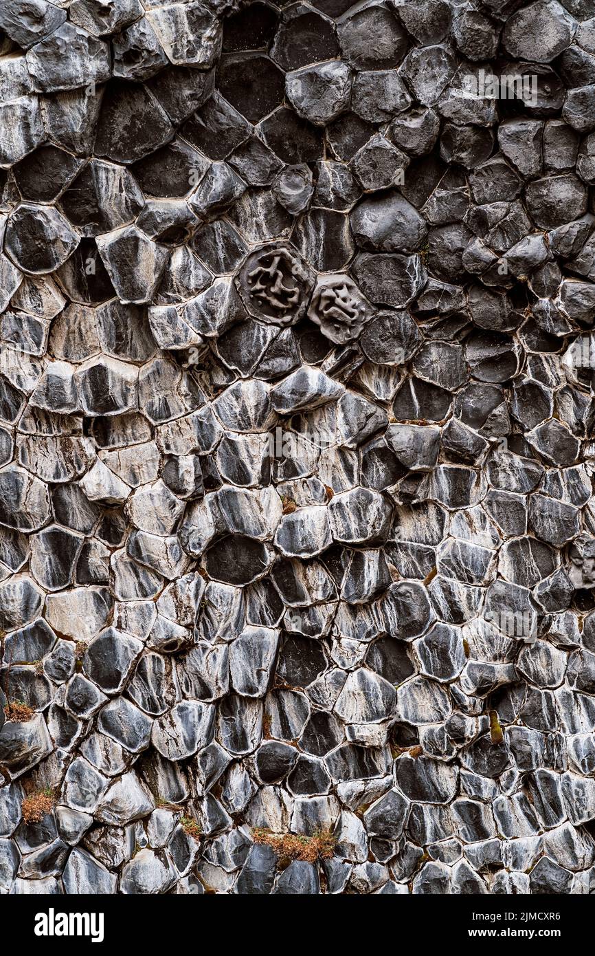 From below of textured surface of columnar basalt rock formation as ...