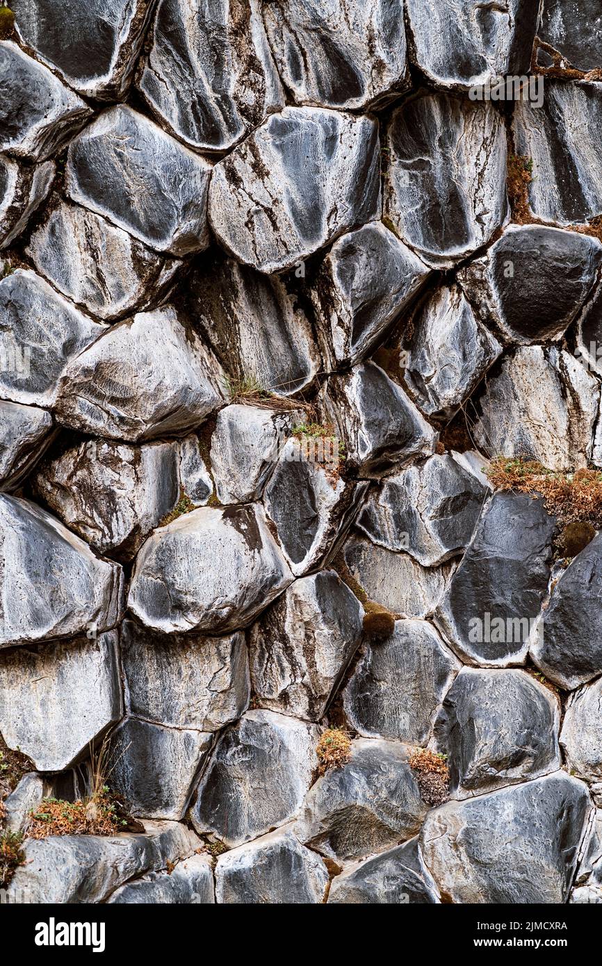 From below of textured surface of columnar basalt rock formation as ...
