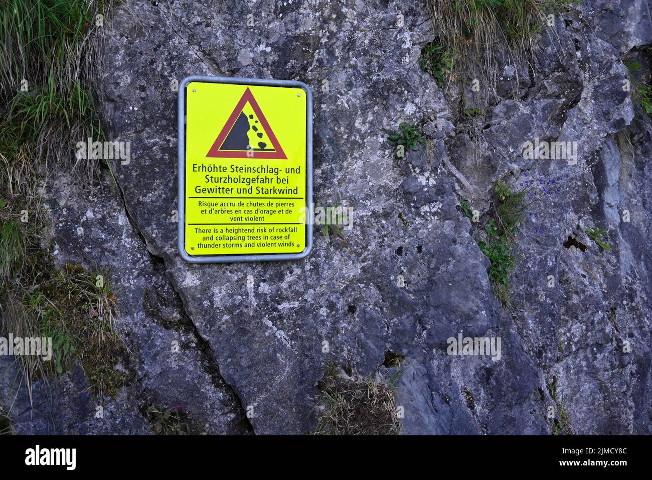 Warning sign stone chip Stock Photo - Alamy