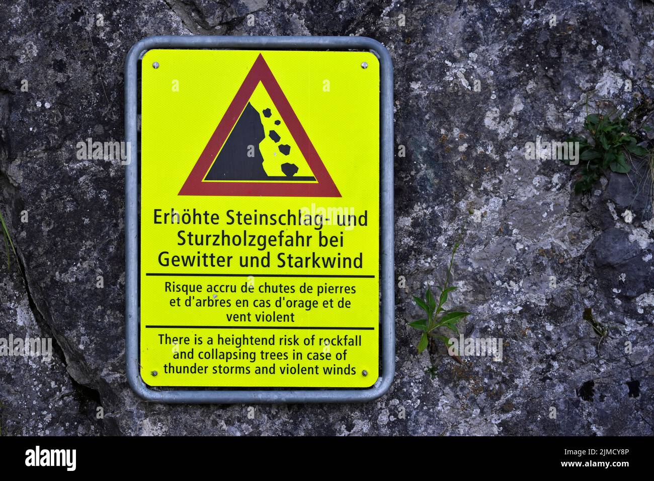 Warning sign stone chip Stock Photo - Alamy