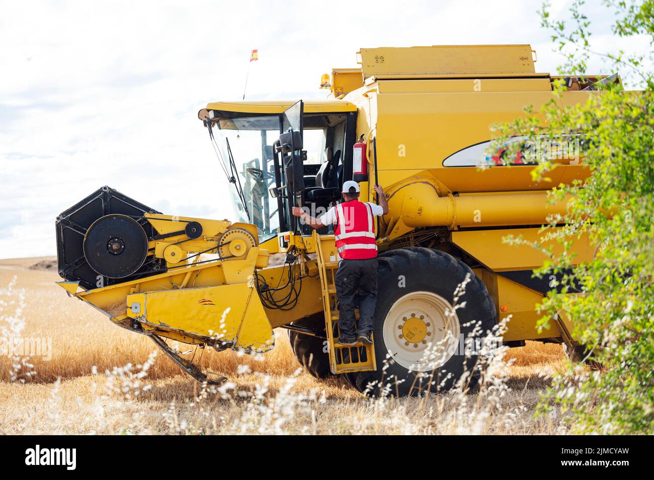 Full body back view of unrecognizable male worker in uniform getting ...