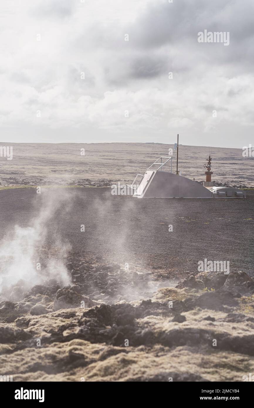Aerial view of modern geothermal power plant located on volcanic ...