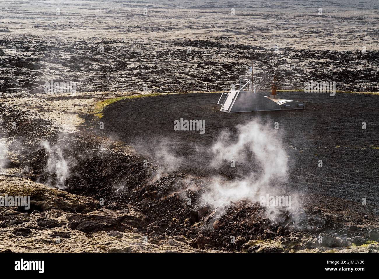 Aerial view of modern geothermal power plant located on volcanic ...