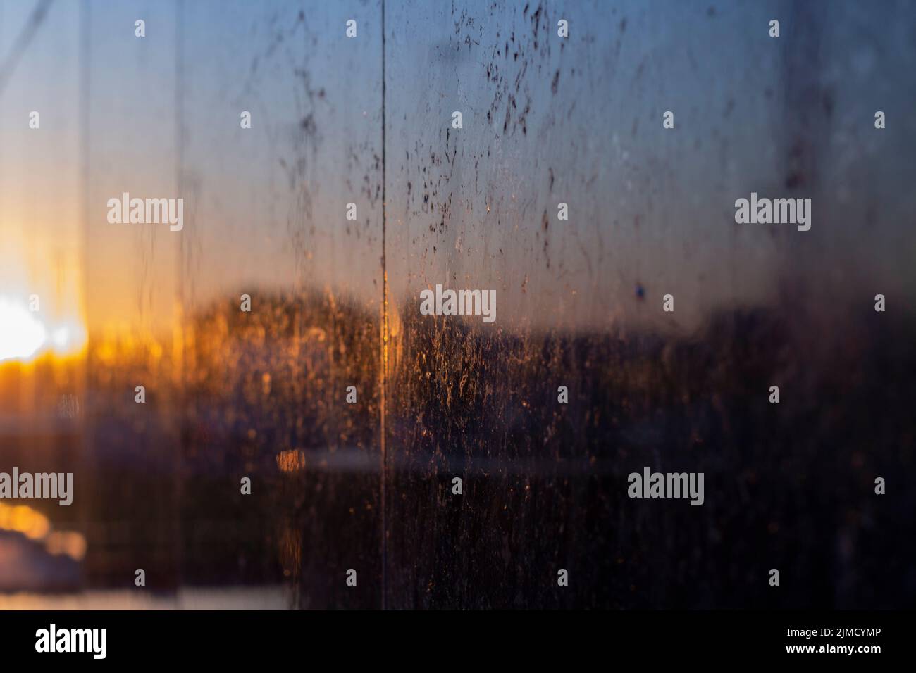 Reflection of light on the cladding. The sunset sun is reflected in the ...