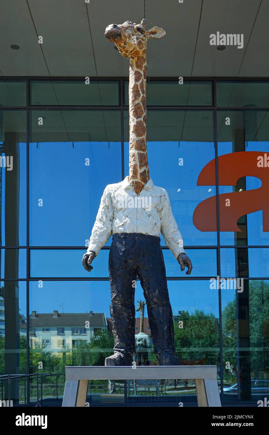 Artwork Giraffe Man by Stephan Balkenhol, in front of the building of ...