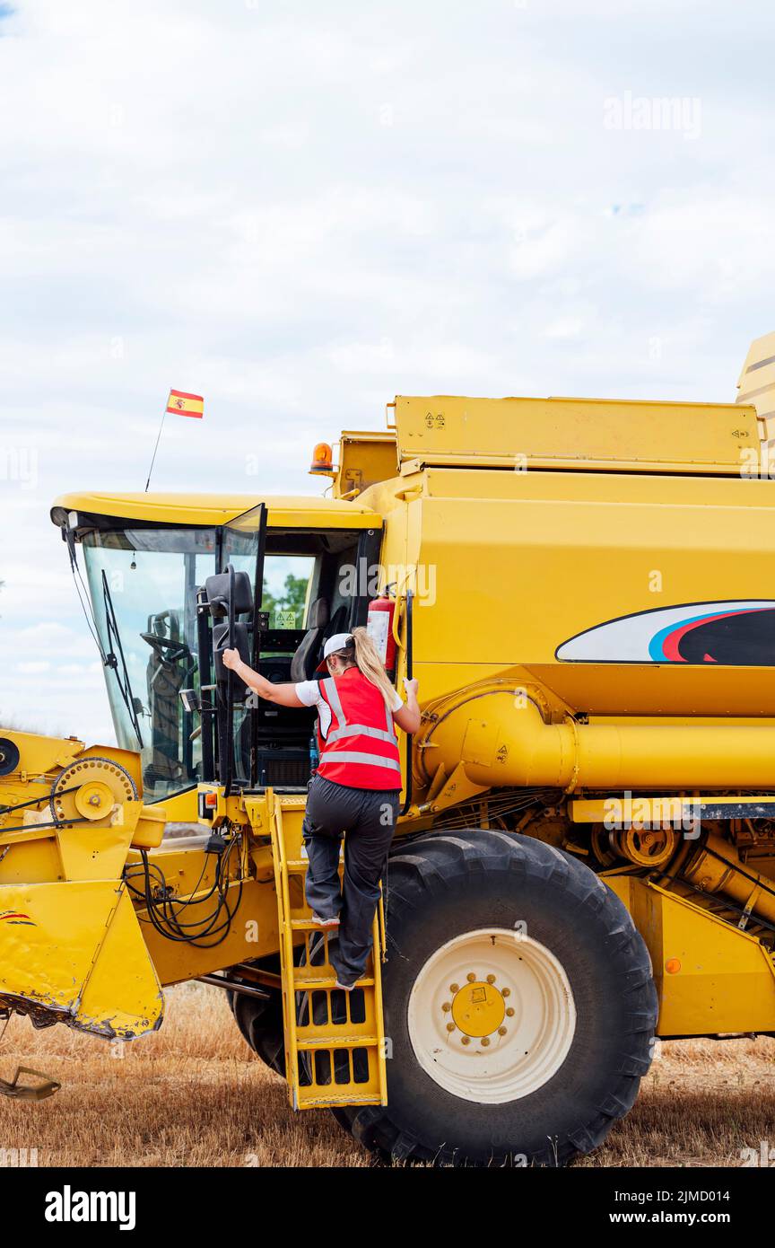 Full body back view of unrecognizable female worker in uniform getting ...