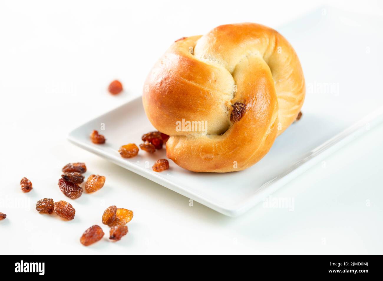 From above delicious twisted bun served with sweet raisins on ...