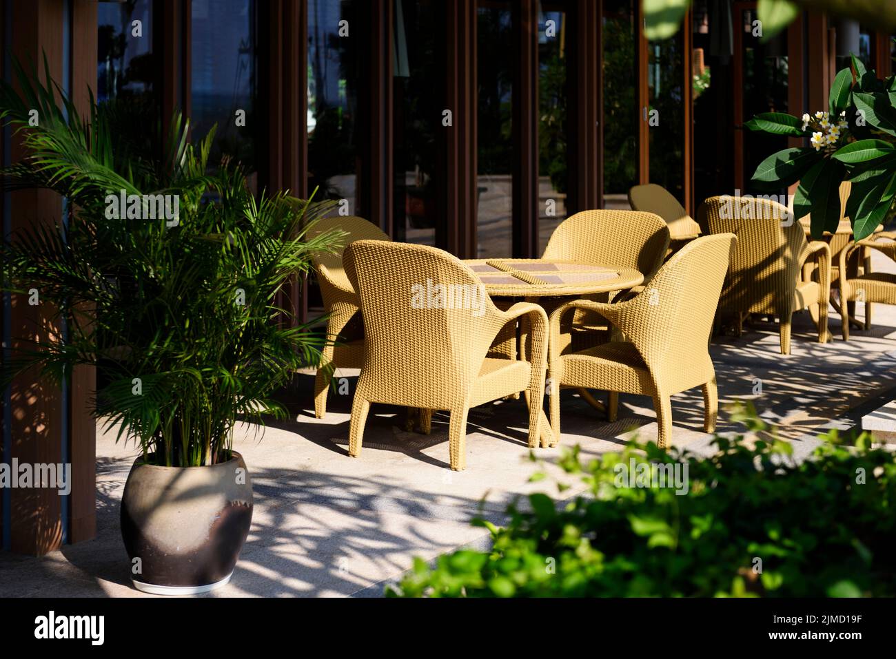 Vacation resort with table and chair set for relaxed Stock Photo - Alamy