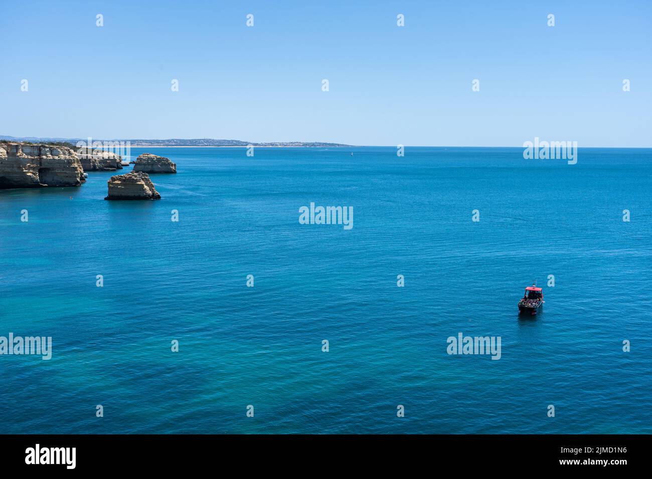 From above anonymous people on a boat on a blue ocean Stock Photo - Alamy