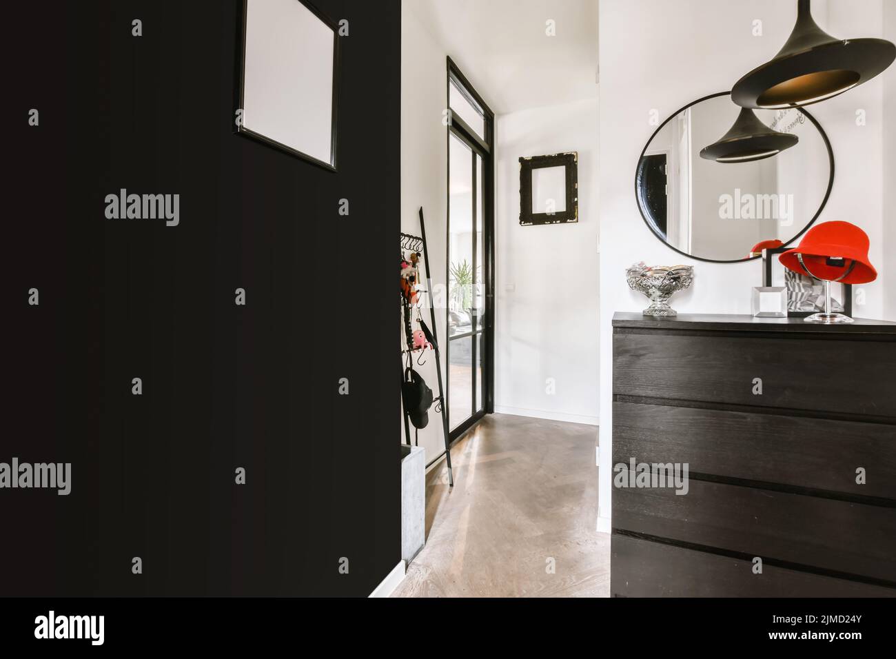 Interior passage way with mirror on wall in modern house Stock Photo ...