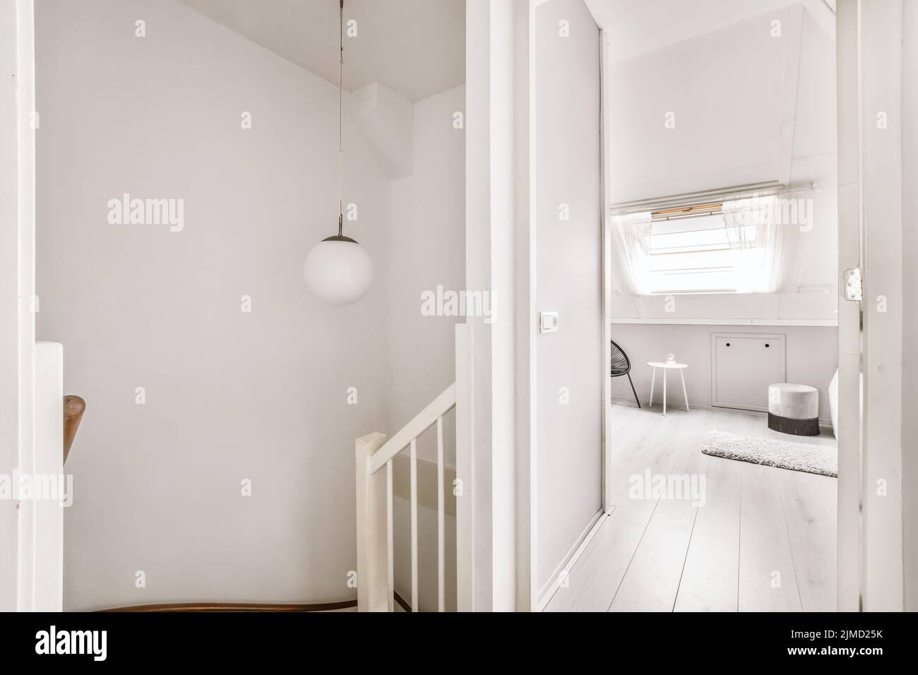 Interior of a house with stairs to an down floor in a bright ...