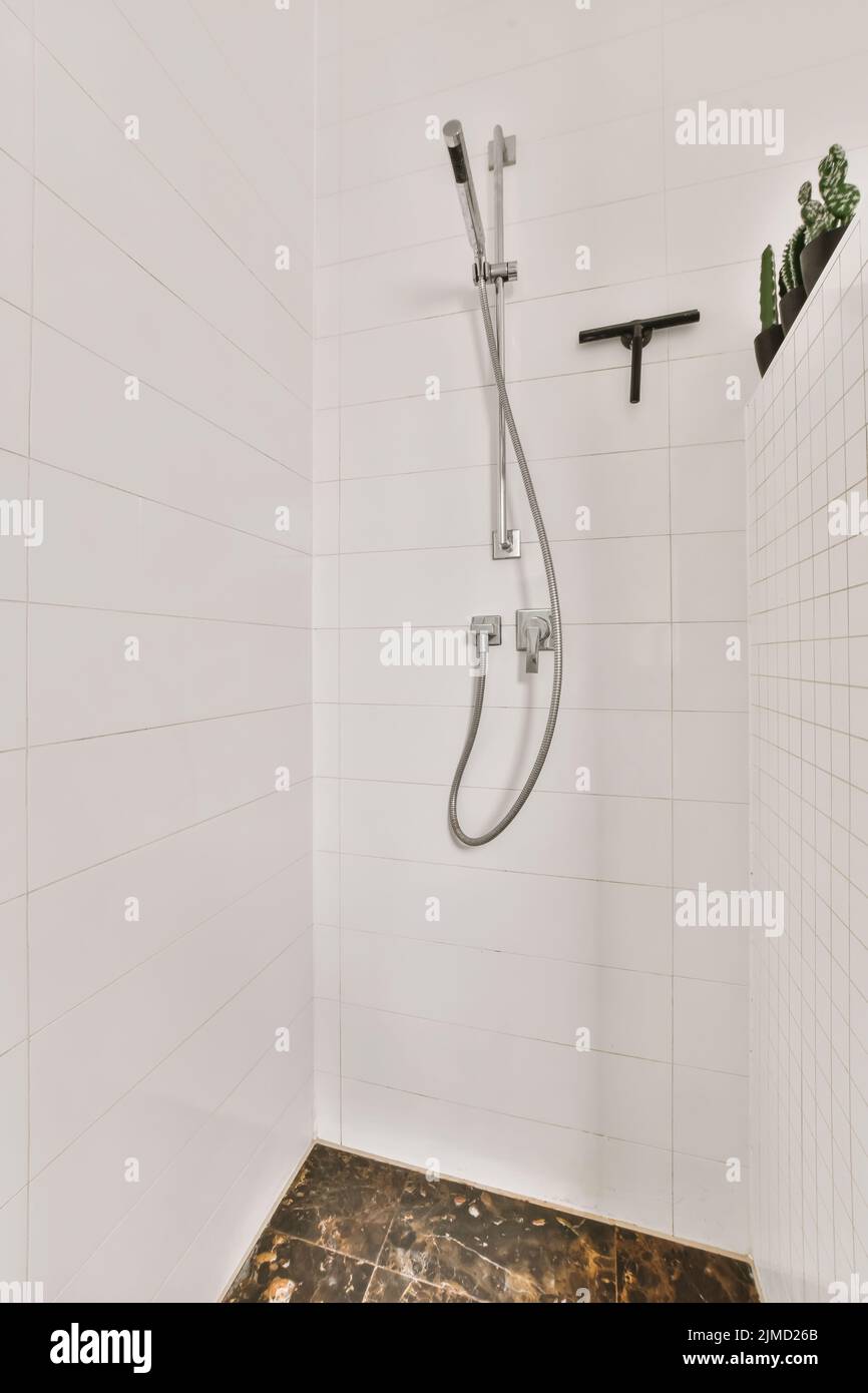 Interior of a modern shower with white walls Stock Photo - Alamy