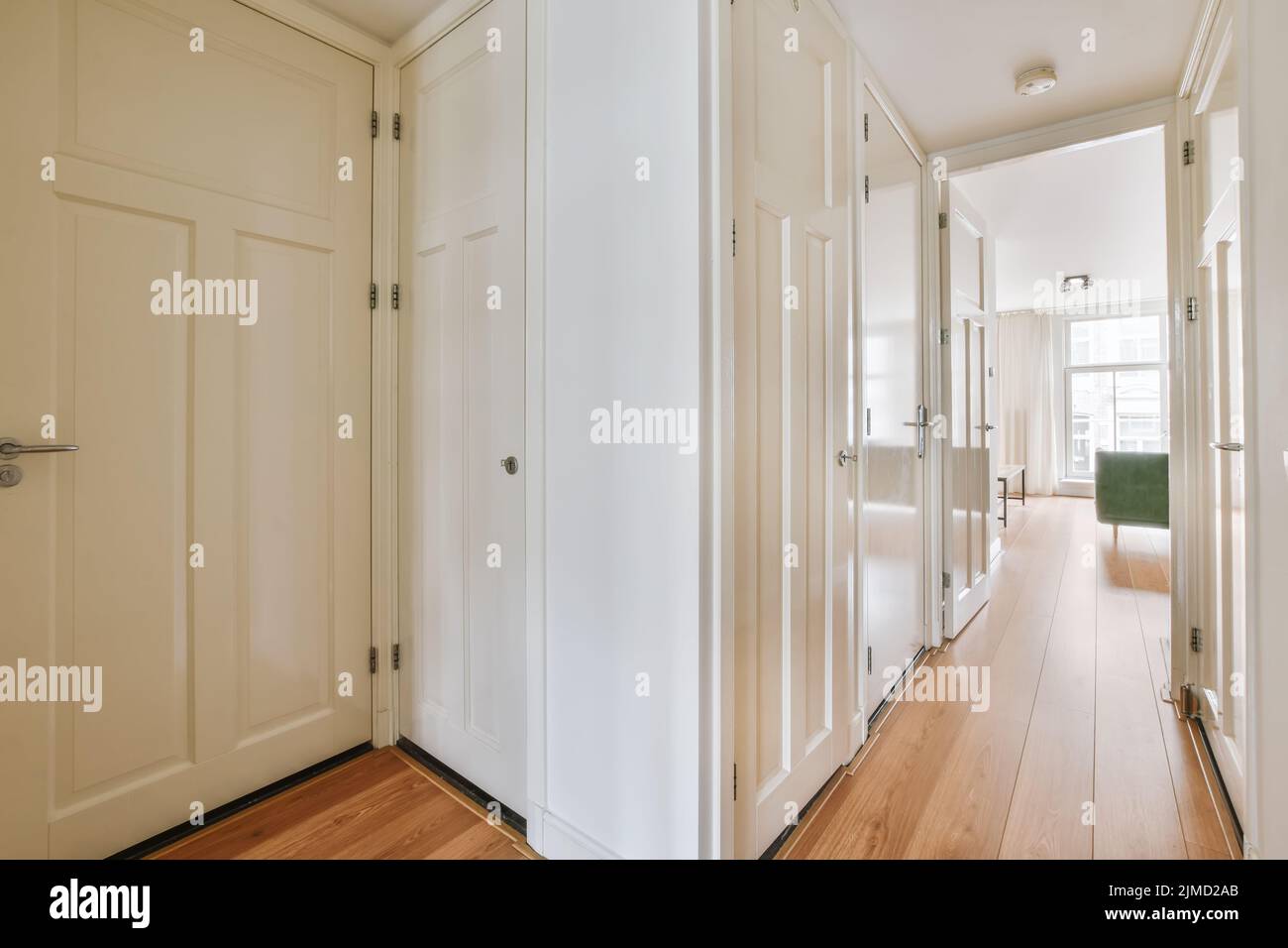 Interior passage way in bright modern house with parquet floor Stock ...
