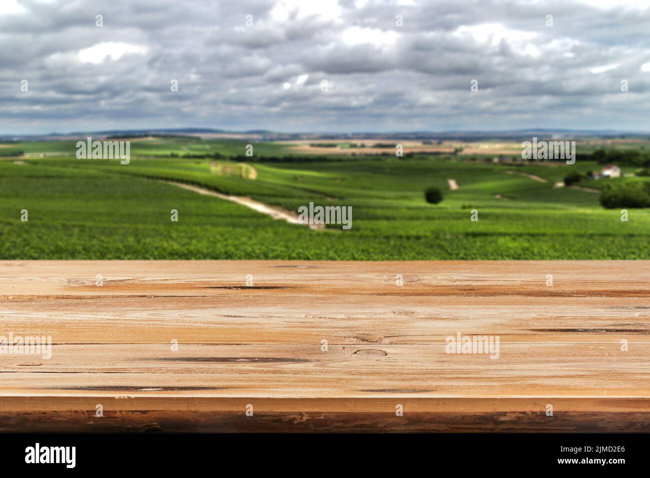 Retro wooden table on a natural countryside background for display or ...